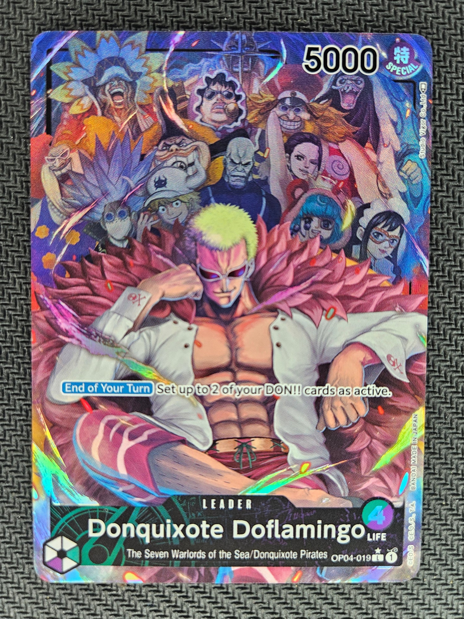 One Piece TCG Kingdoms of Intrigue OP04-019 Donquixote Doflamingo Lead – Mint Collectables
